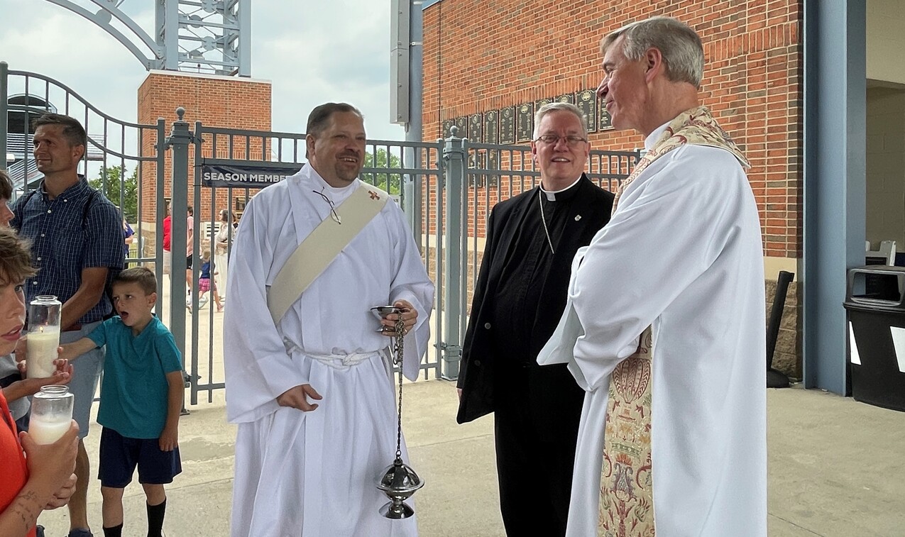 First ballpark Mass is a hit despite rain