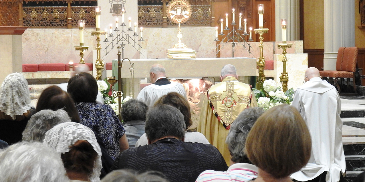 Legion of Mary members gather for prayer, procession, adoration