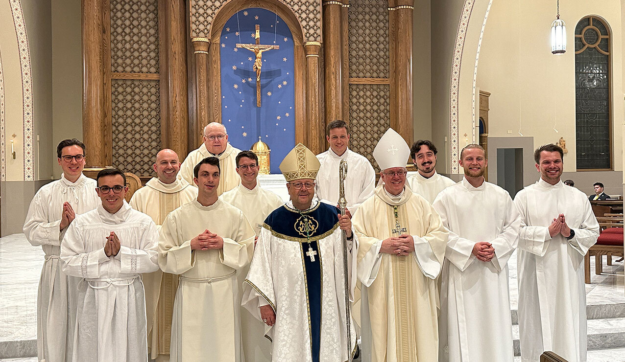 Eight men in formation are instituted in ministry of lector